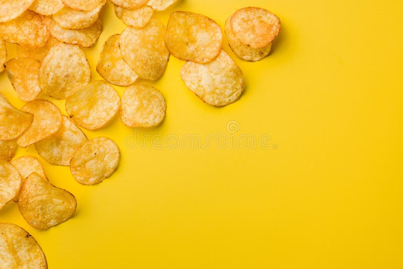 Crispy Potato Chips on Yellow Background. Top View Stock Photo - Image ...