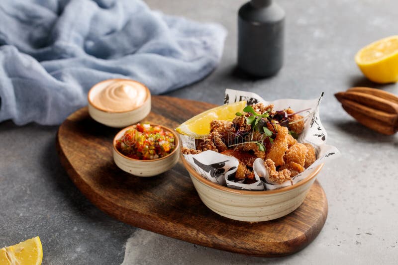 Crispy Prawns and Calimari with Dip and Lime Served in Dish Isolated on ...