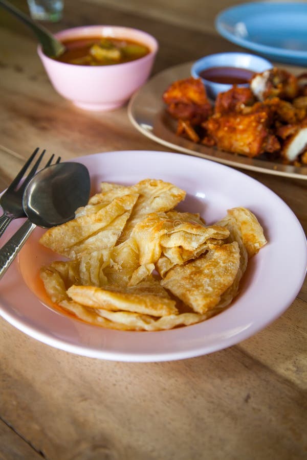 Crispy Roti on a Plate Set on a Wood Table. Stock Photo - Image of ...