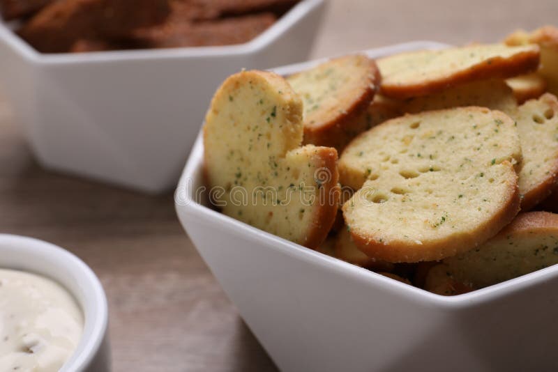 Crispy Rusks in Bowl on Wooden Table, Closeup Stock Image - Image of ...