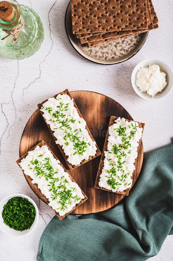 Crispy Rye Bread with Cottage Cheese and Green Onions on a Board Top ...