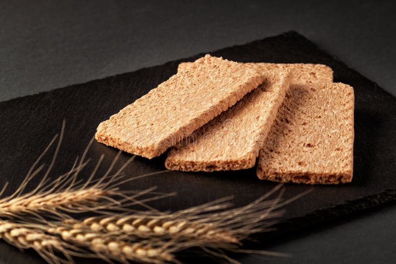 Crispy Rye Bread on a Serving Board with Rye Ears Stock Photo - Image ...