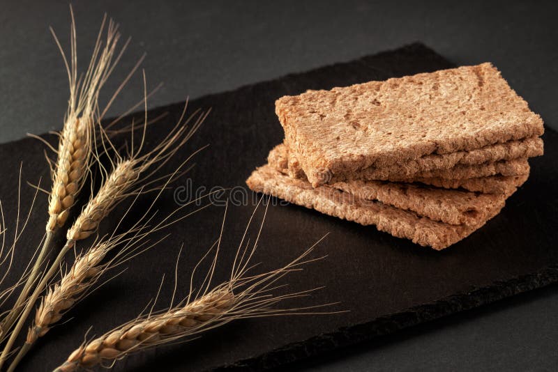 Crispy Rye Bread on a Serving Board with Rye Ears Stock Image - Image ...