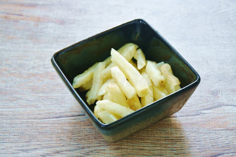 Crispy Snack French Fries Mixed with Salt in Cup on Table Stock Photo ...