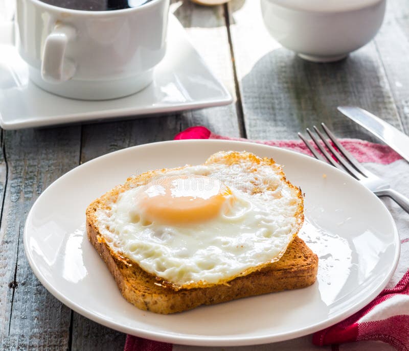 Crispy Toast with a Fried Egg and a Glass of Water, Lemon, Break Stock ...