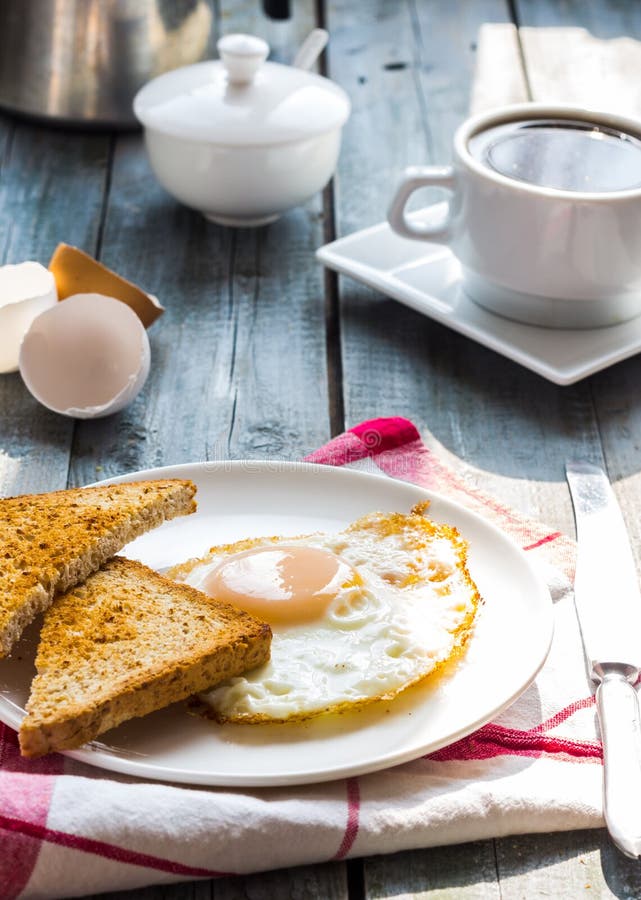 Crispy Toast with a Fried Egg and a Cup of Coffee. English Break Stock ...