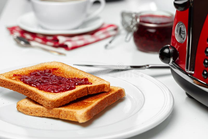 Crispy Toasts Covered with Fruit Jam Served on Kitchen Table Stock ...