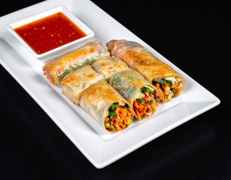 Crispy Vegetable Spring Rolls with Dipping Sauce and Open Filling Stock ...