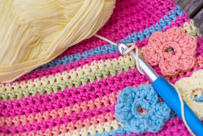 Crocheted Colorful Background with Crochet Hook and a Wool Ball Stock ...