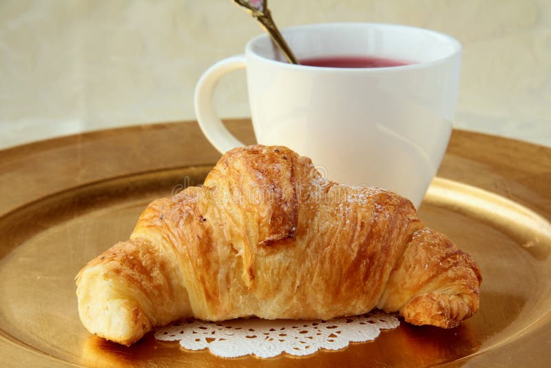 Croissant and a cup of tea stock image. Image of gourmet - 17266591