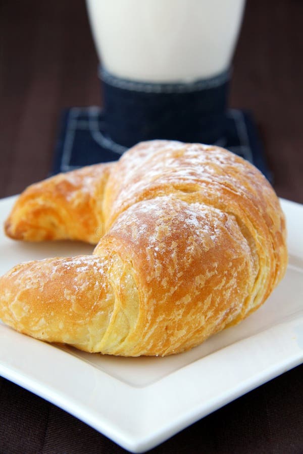 Croissant and a cup of tea stock photo. Image of croissant - 17755118
