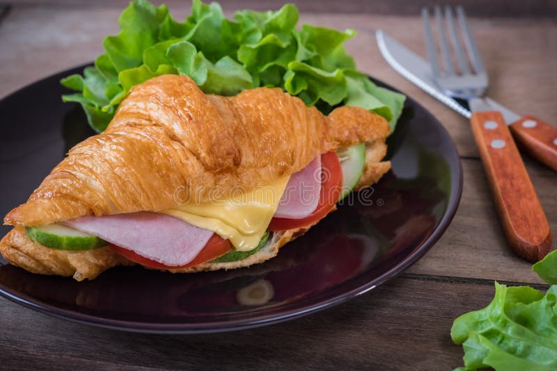 Croissant with Ham, Cheese and Vegetable on Plate Stock Photo - Image ...