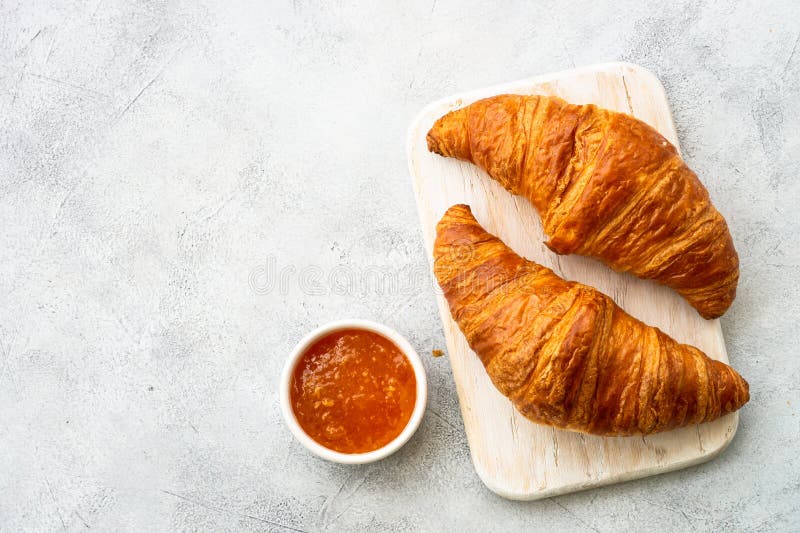 Croissant with Jam on Cutting Board at Stone Table Top View. Stock ...