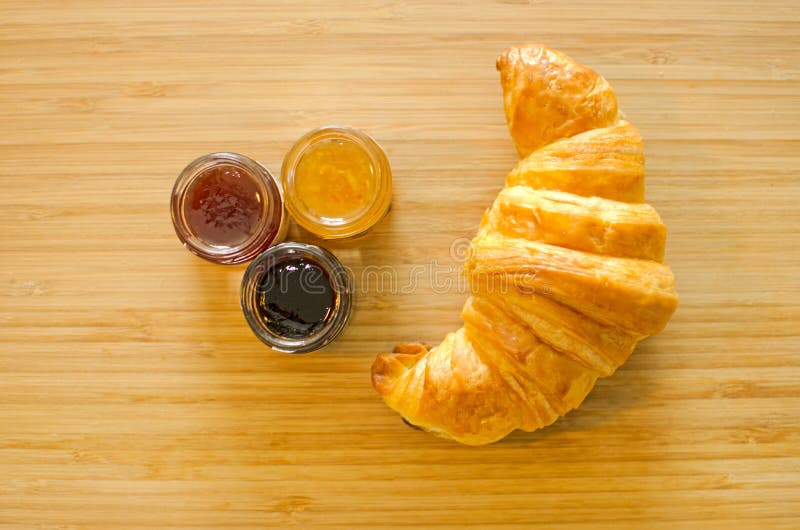 Croissant and jam jars stock image. Image of orange, bake - 55611397