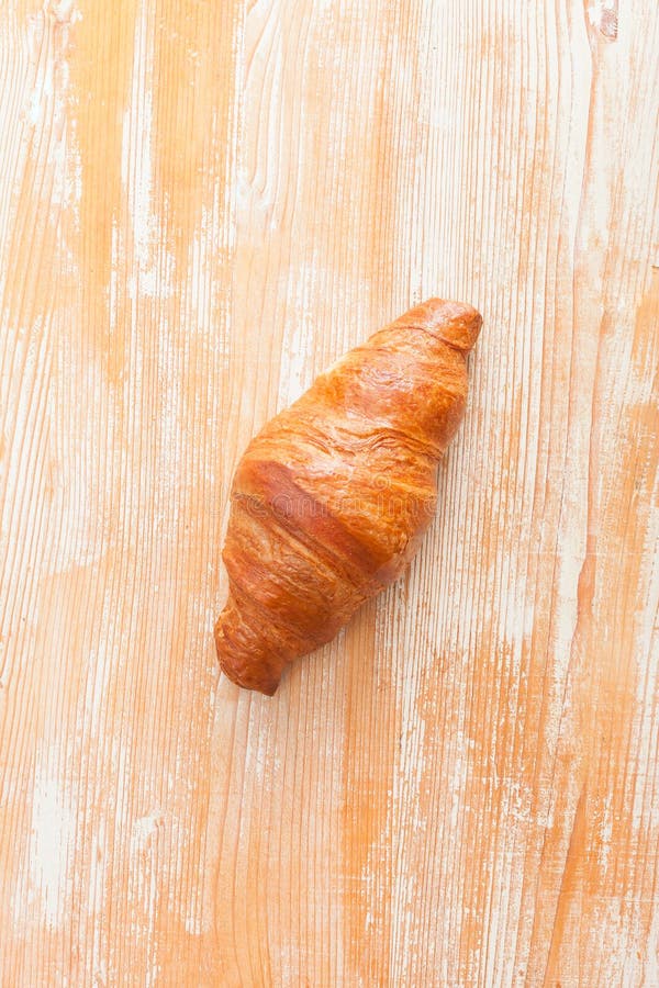 Croissant on Light Wooden Surface Stock Photo - Image of bake, wooden ...