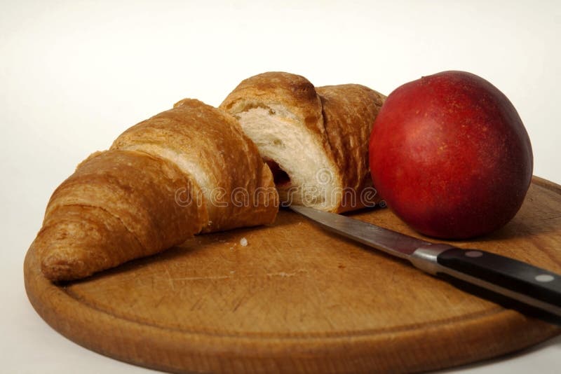 Croissant and Peach on the Board Stock Photo - Image of closeup ...