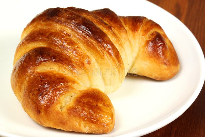 Croissant on plate stock photo. Image of morning, croissant - 14135654