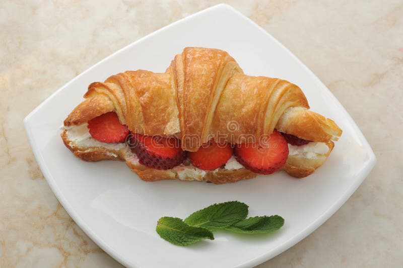 Croissant Stuffed with Strawberries Stock Photo - Image of strawberries ...