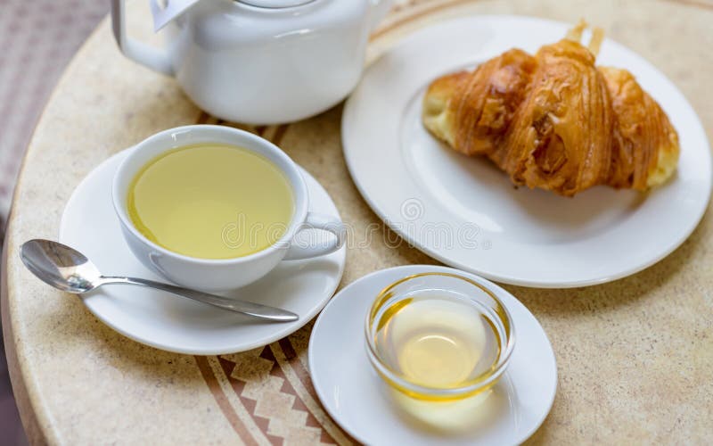 Croissant and tea stock photo. Image of bright, cuisine - 61856538