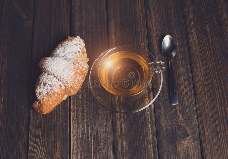 Croissant with Tea on Wooden Desk Stock Image - Image of wood, drink ...