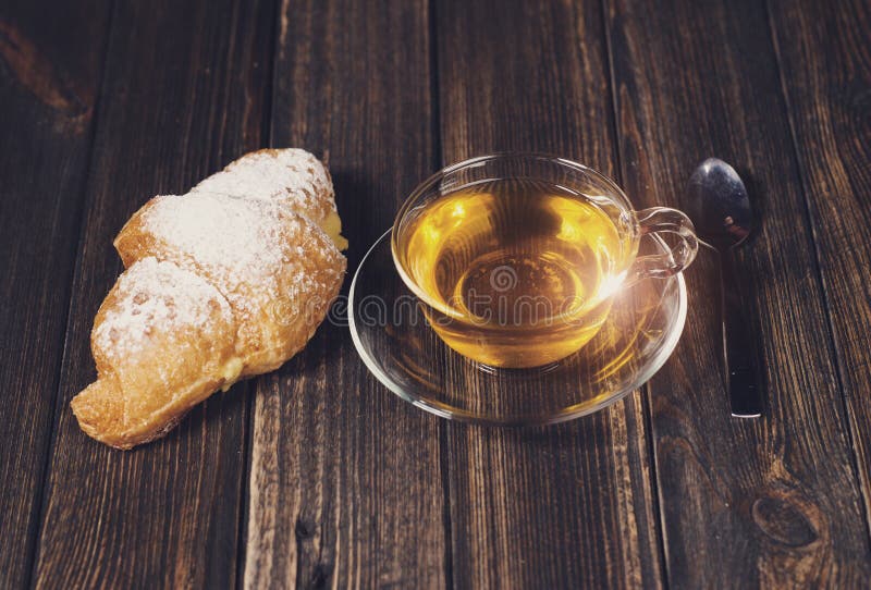 Croissant with Tea on Wooden Desk Stock Image - Image of desk ...