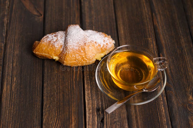 Croissant with Tea on Wooden Desk Stock Photo - Image of bakery ...