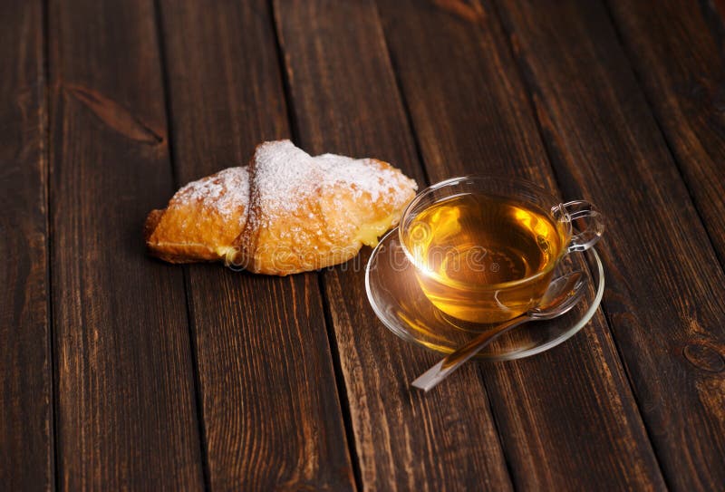 Croissant with Tea on Wooden Desk Stock Image - Image of slice, drink ...