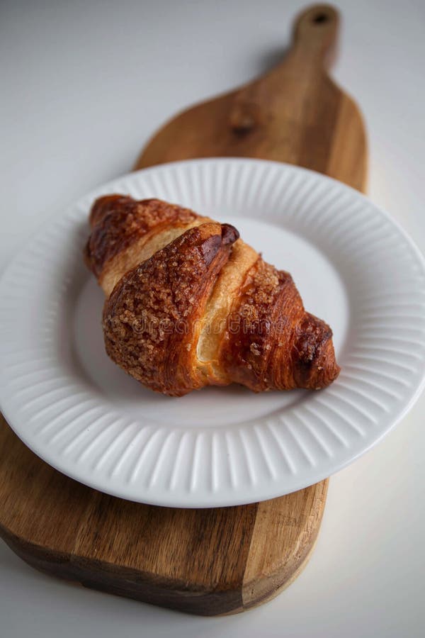 Croissant in a White Plate and Wood Desk Stock Image - Image of ...