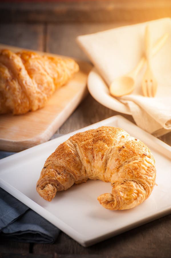 Croissant on wood table stock photo. Image of kitchen - 60286404