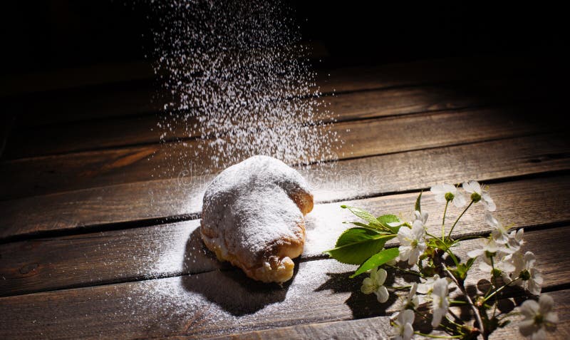 Croissant on Wooden Desk with Falling Powdered Sugar Stock Photo ...