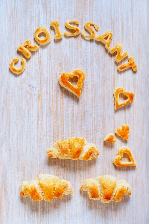 Croissants and Letters of Dough on the Table Stock Photo - Image of ...