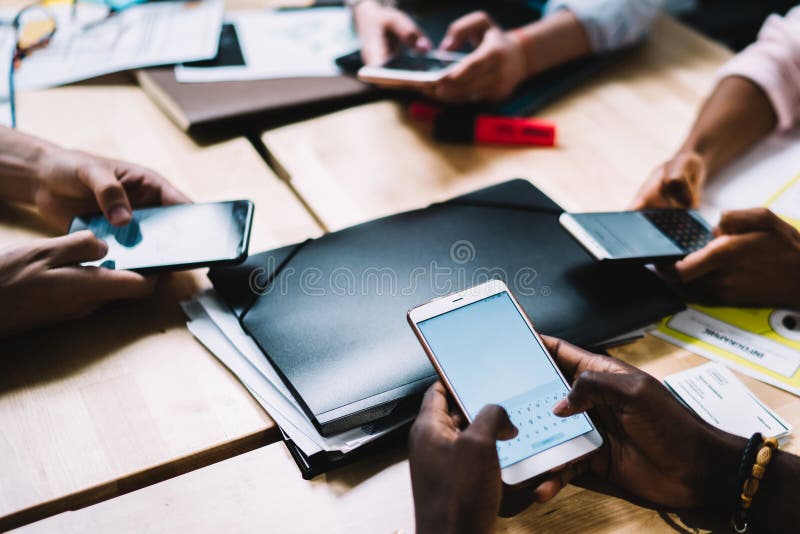 Anonymous People Using Smartphones in Office Stock Photo - Image of ...