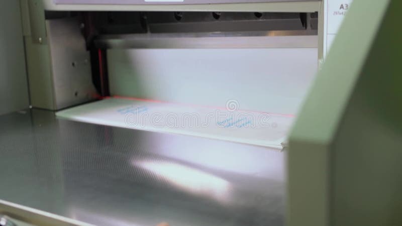 Person Working with Paper Cutter Machine in Printing House Stock Video ...