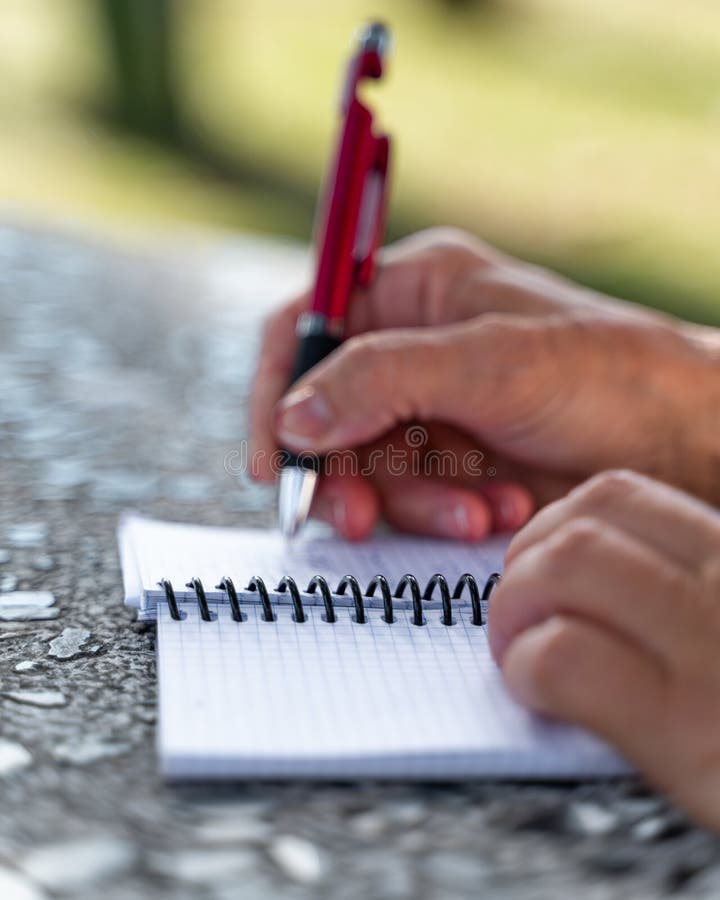 Crop Anonymous Person Writing Notes with a Pen in a Notebook Stock ...