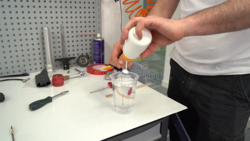 Male Master Making Liquid Solution while Assembling Prosthesis Stock ...