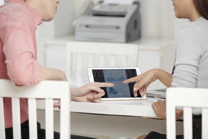 Young Coworkers Using Tablet in Office Stock Image - Image of corporate ...