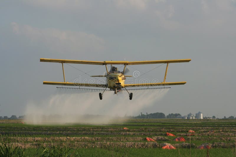Biplane Crop Duster in Action Stock Image - Image of biplane, farming ...