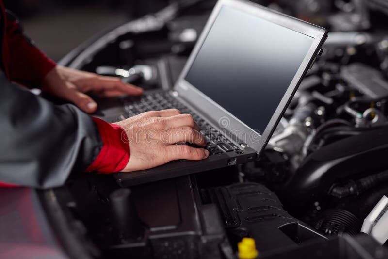 Technician Checking Car Engine with Laptop Stock Photo - Image of ...