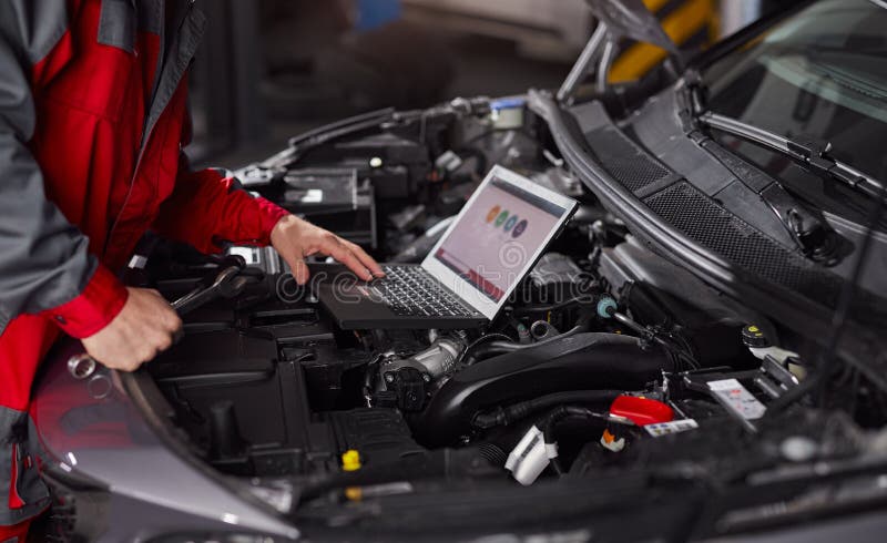 Crop Mechanic Using Laptop during Car Diagnostics Stock Image - Image ...