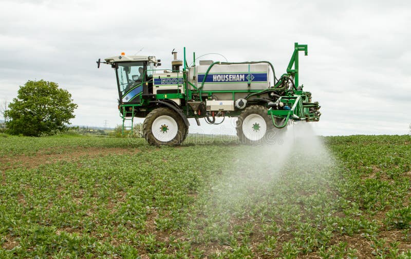 Crop Spraying in field editorial photography. Image of blue - 54209787