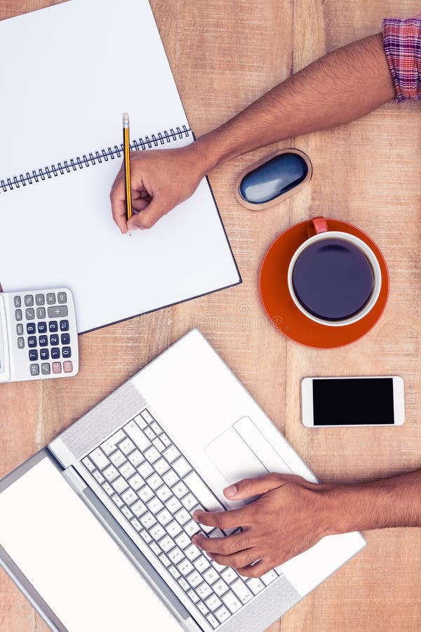 Cropped Businessman Working on Laptop while Writing on Book Stock Image ...