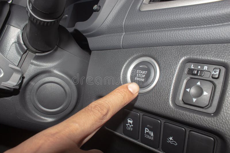 Cropped Finger Pressing Start Button in Car while Test Driving Stock ...