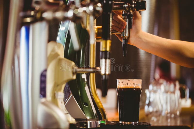 Cropped Hand of Bartender Dispensing Beer Stock Image - Image of hand ...
