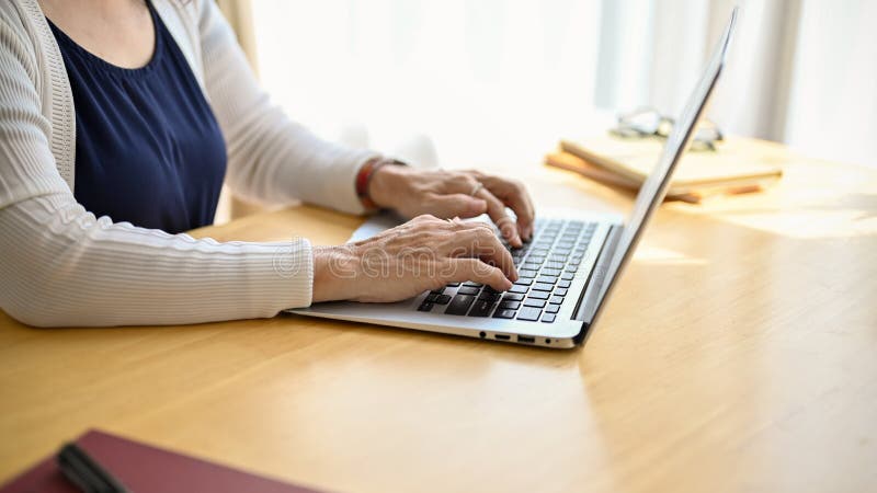 Cropped Image of an Asian Middle Aged Woman Using Portable Computer ...