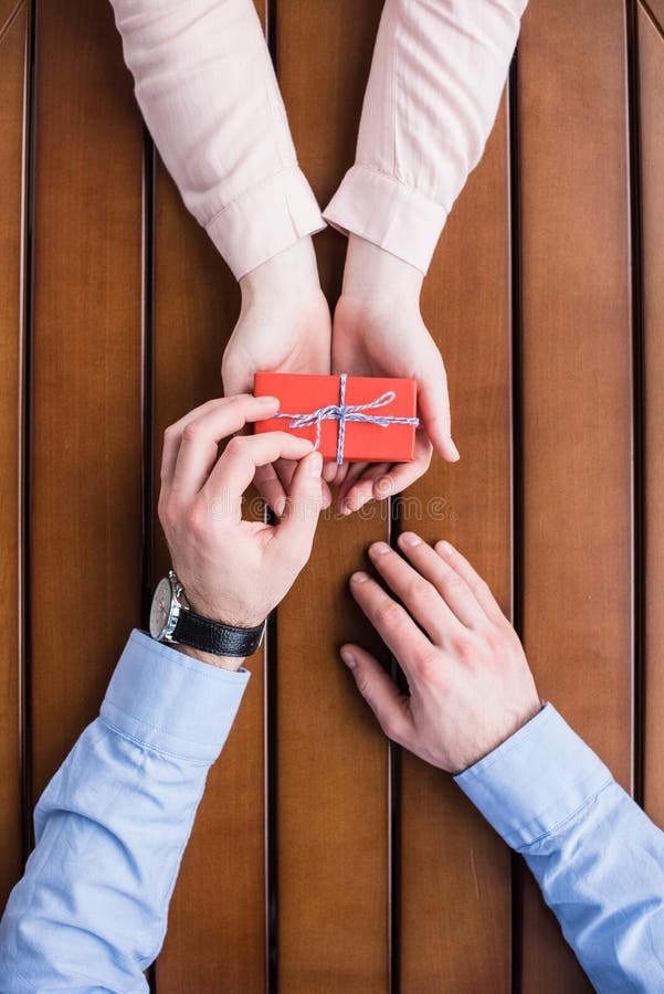 Boyfriend Untying Ribbon Bow on Present Box Stock Image - Image of male ...