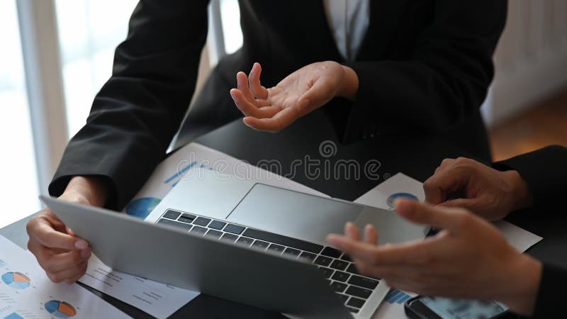 Business People Analyzing Financial Data on Computer Laptop Together ...