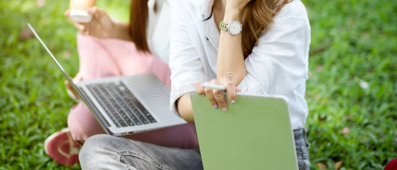 Cropped Image of Female College Students Relaxing in a Campus Park ...
