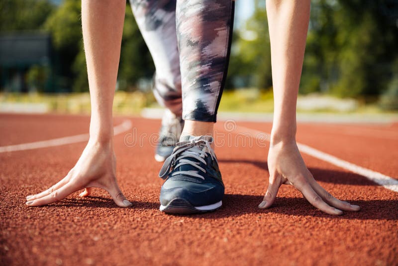 Cropped Image of a Female Sprinter Getting Ready To Run Stock Photo ...