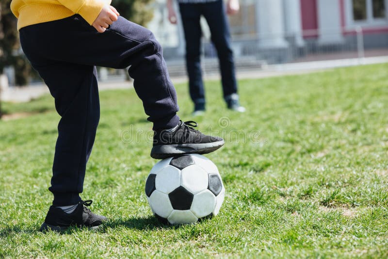 Cropped Image of a Little Boy with Football Playing Stock Photo - Image ...
