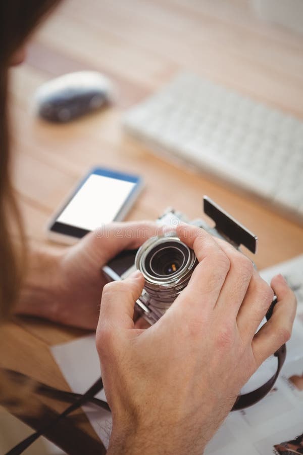 Man adjusting camera lens stock image. Image of closeup - 60556373